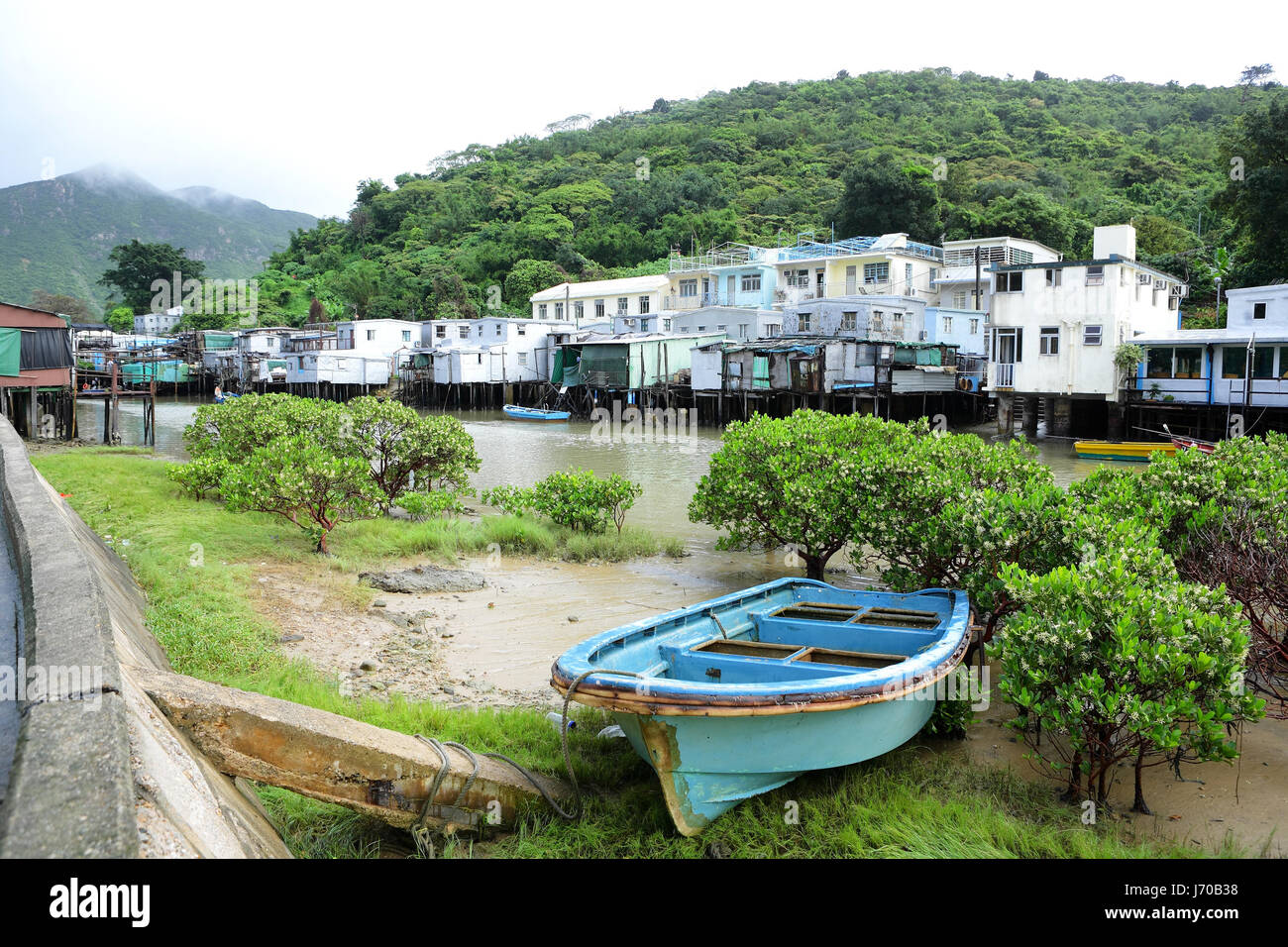 house building fishing stilt community village market town blue house ...