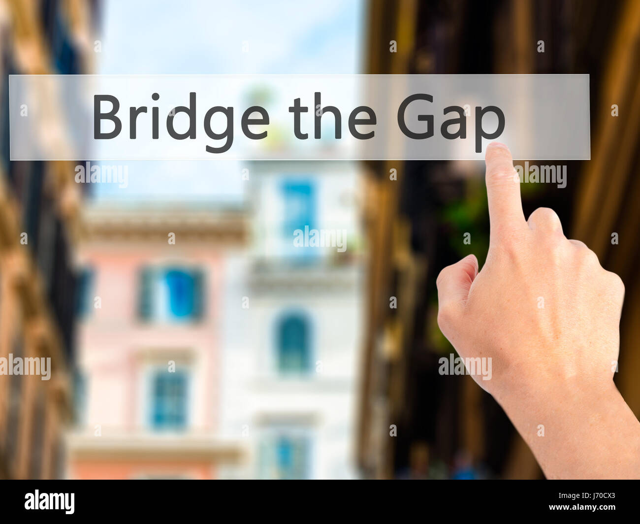 Bridge the Gap - Hand pressing a button on blurred background concept ...