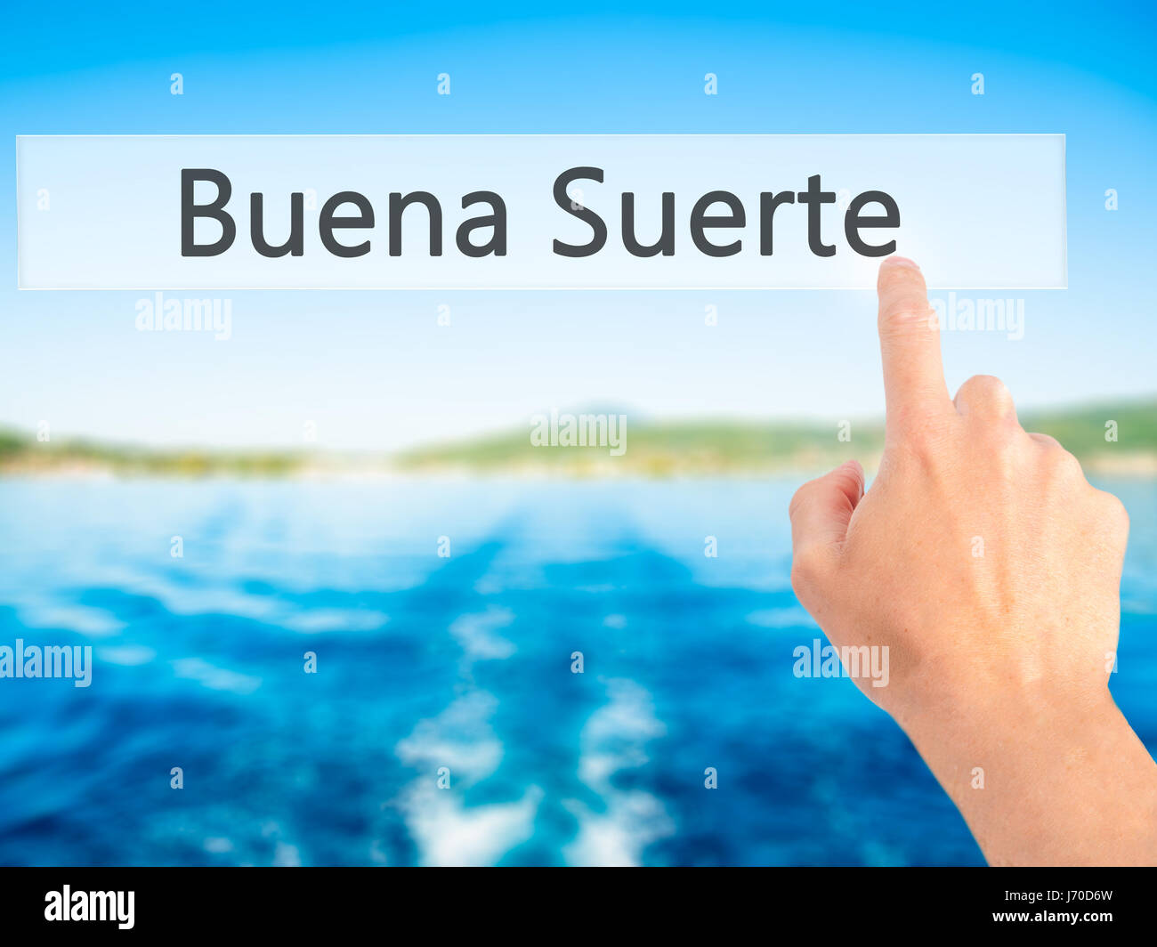 Buena Suerte ( Good Luck in Spanish) - Hand pressing a button on ...