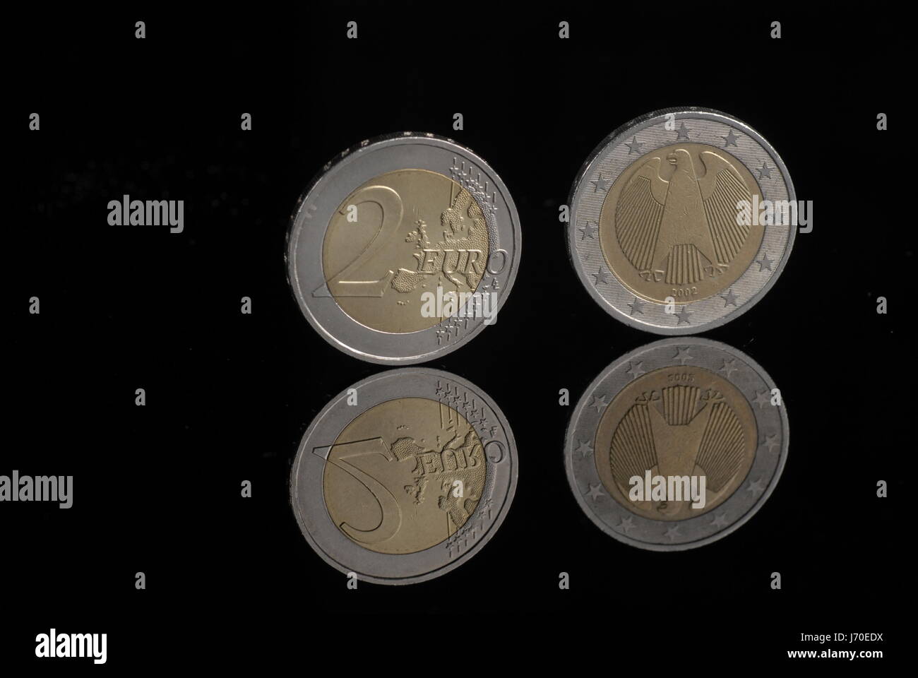 2 euro coin with reflection Stock Photo - Alamy