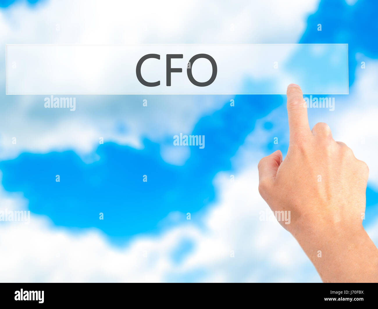 CFO (Chief Financial Officer) - Hand pressing a button on blurred ...