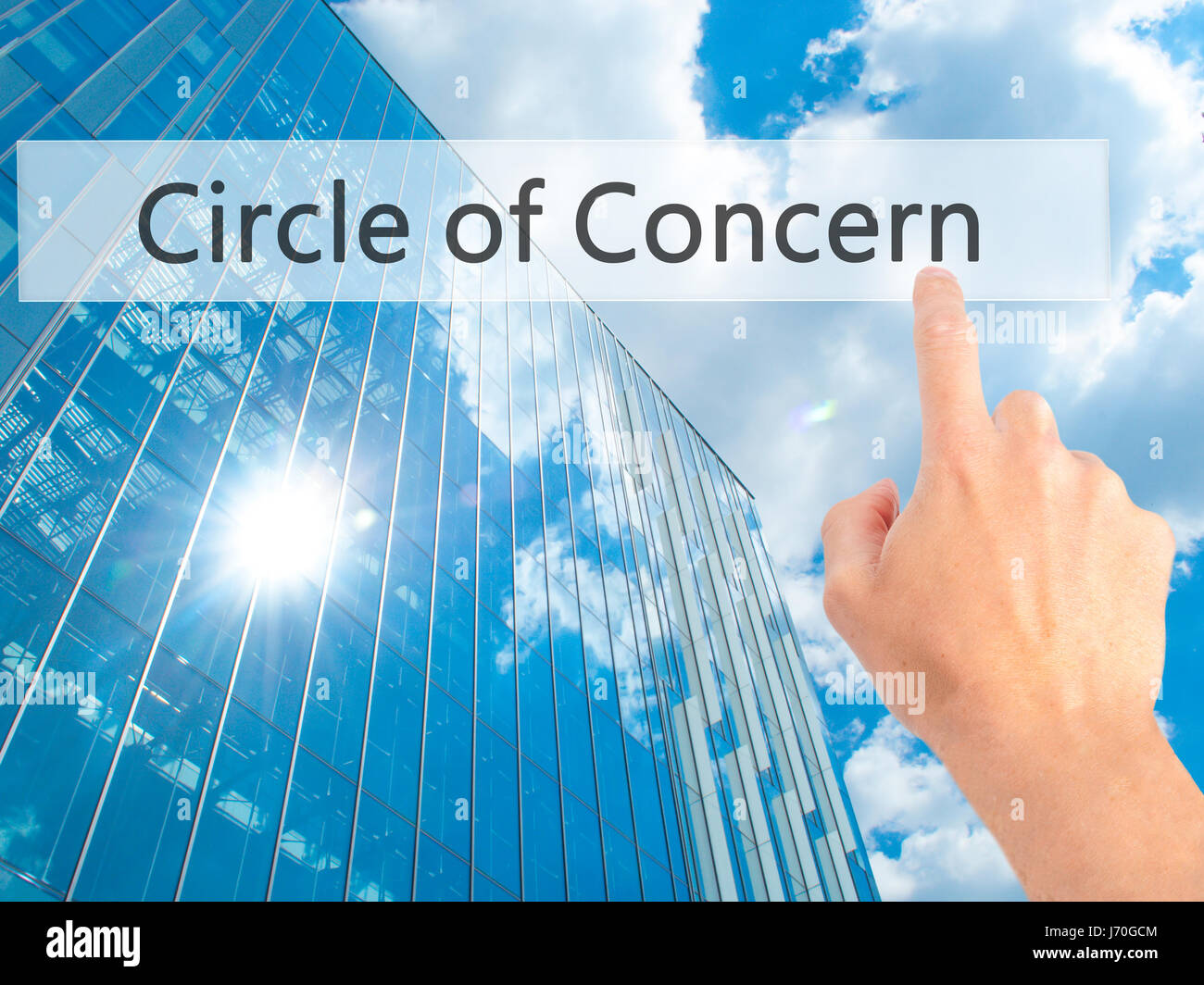Circle of Concern - Hand pressing a button on blurred background ...