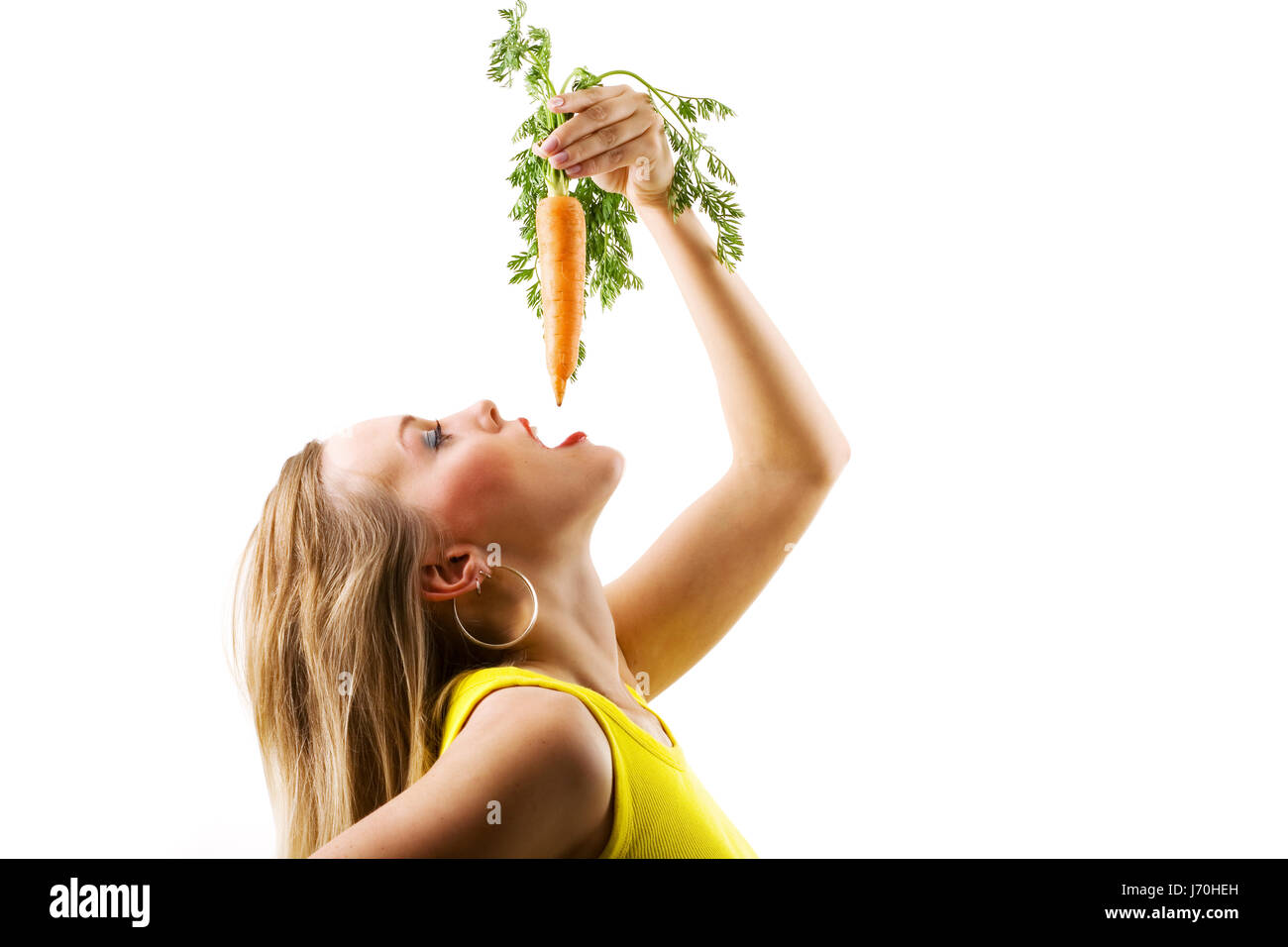 carrot eating profile Stock Photo - Alamy