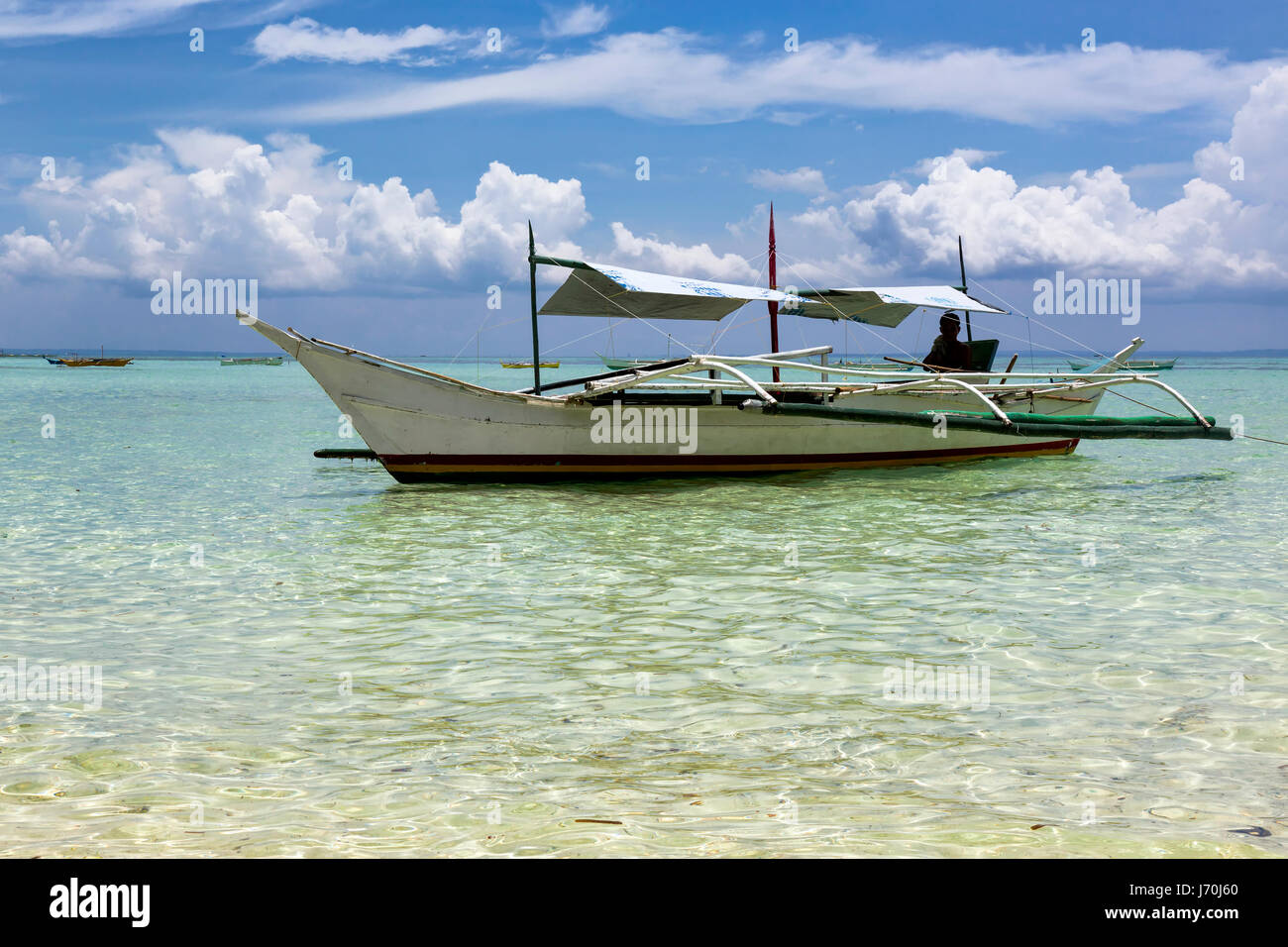 Traditional Philippine boat anchored at the beach in Bantayan, Sebu ...