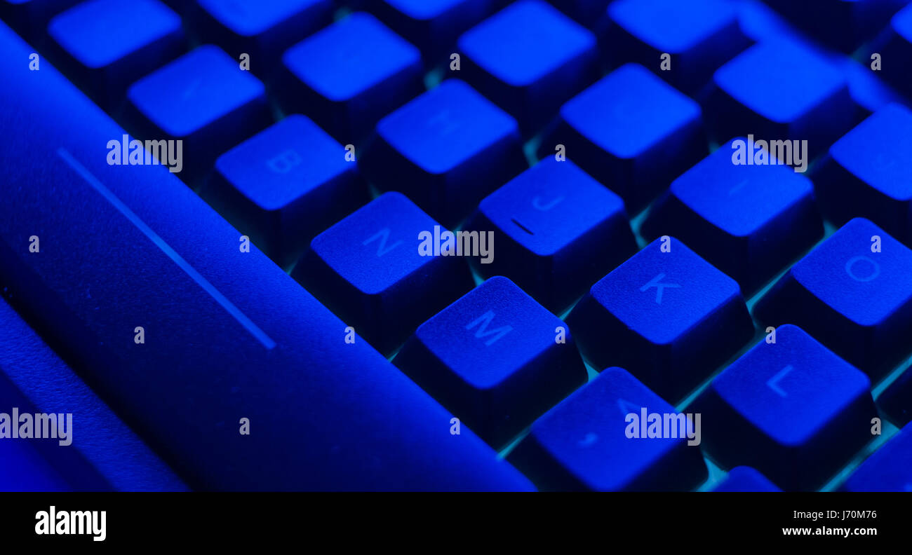 Computer keyboard keys dark blue close-up Stock Photo - Alamy