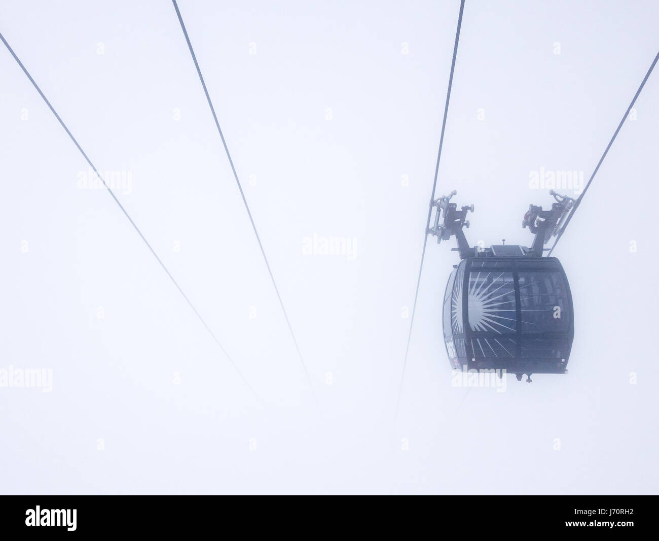 Ski lift carriage in dense fog Stock Photo - Alamy