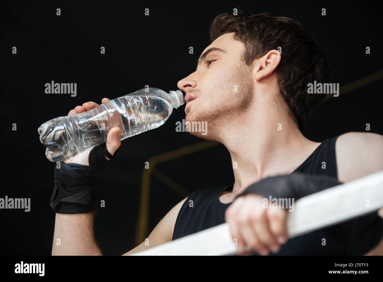 Low view of boxer drinking water with enjoyment on ring Stock Photo - Alamy