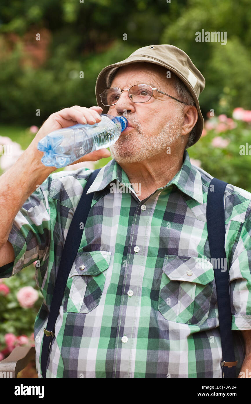 drink drinking bibs garden outside bottle gardens day water man senior ...