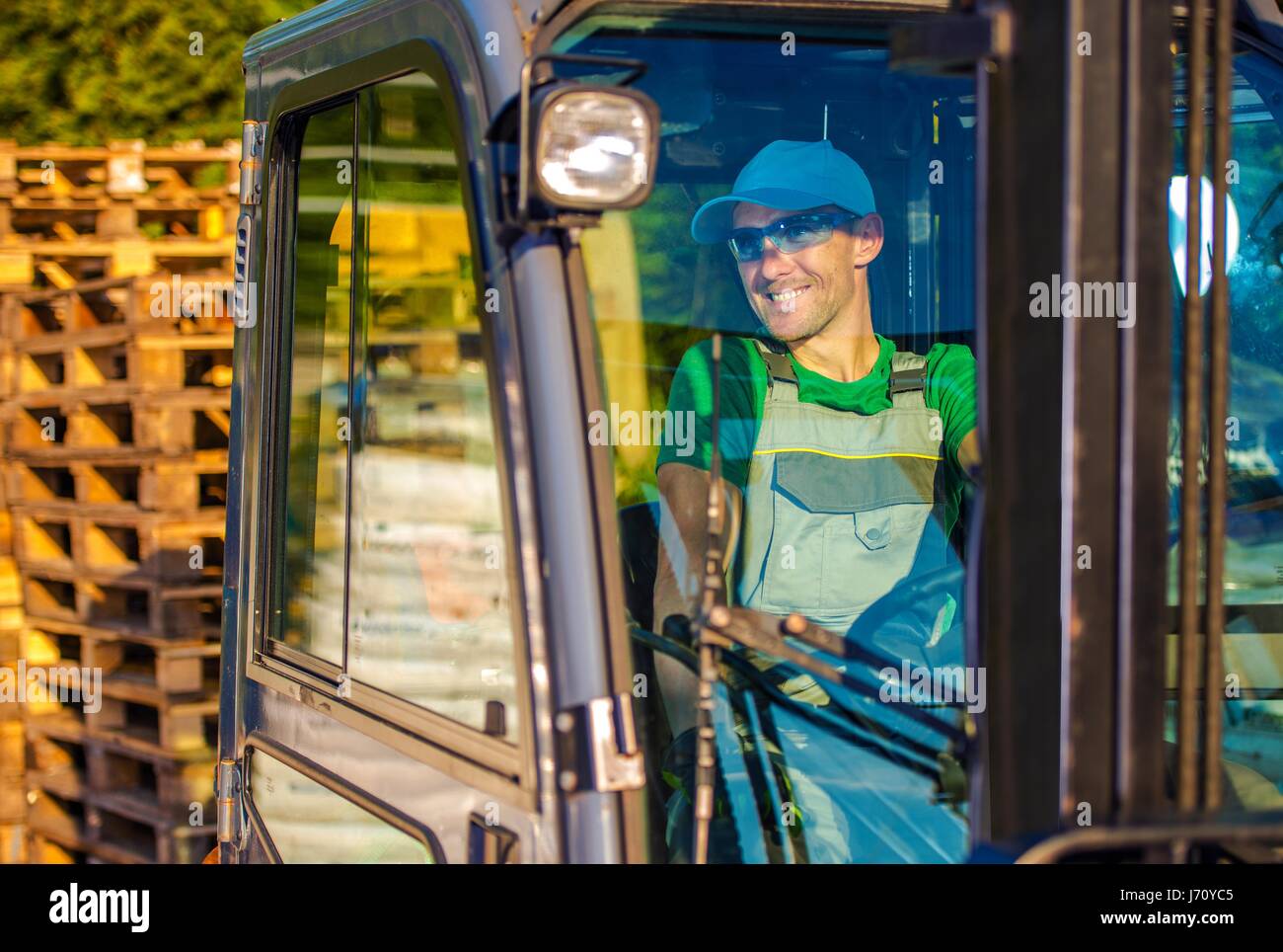Happy Caucasian Forklift Operator Worker in the Garden Department Store ...