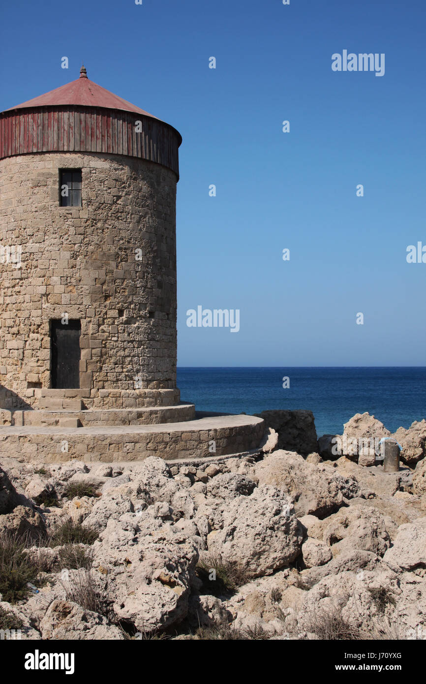 tower city town harbor rock harbours windmill water stones blue tower ...