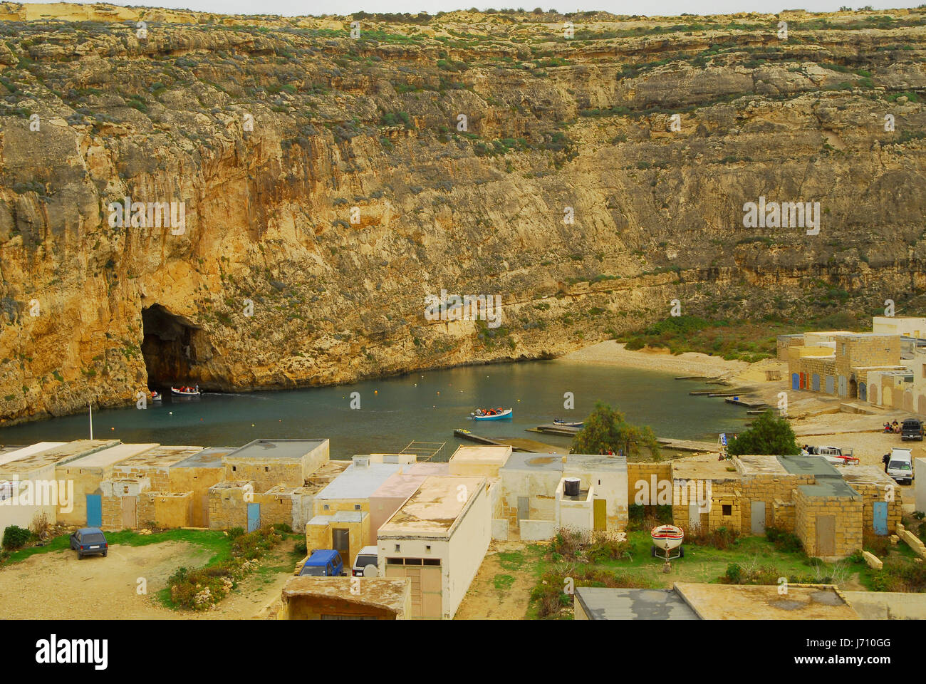 cave rock tunnel coast fishing boats salt water sea ocean water ...