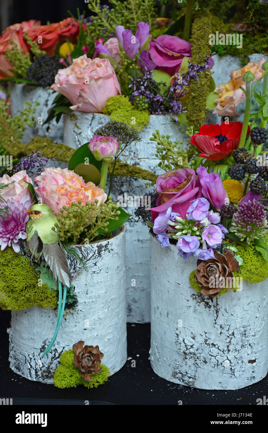 Colorful assorted spring flower arrangements on display Stock Photo - Alamy