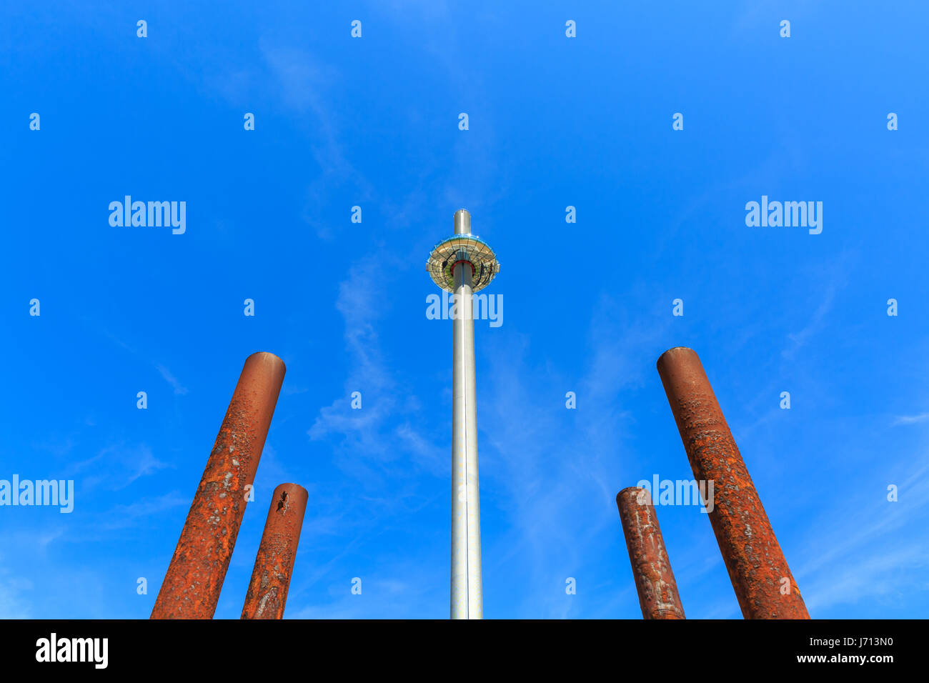 Brighton i360 observation tower on the seafront, with the rusty pier ...