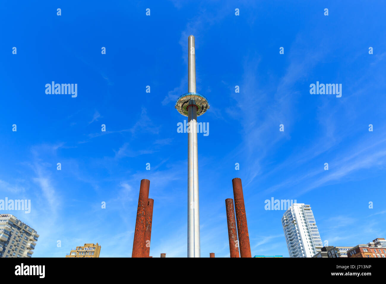 Brighton i360 observation tower on the seafront, with the rusty pier ...
