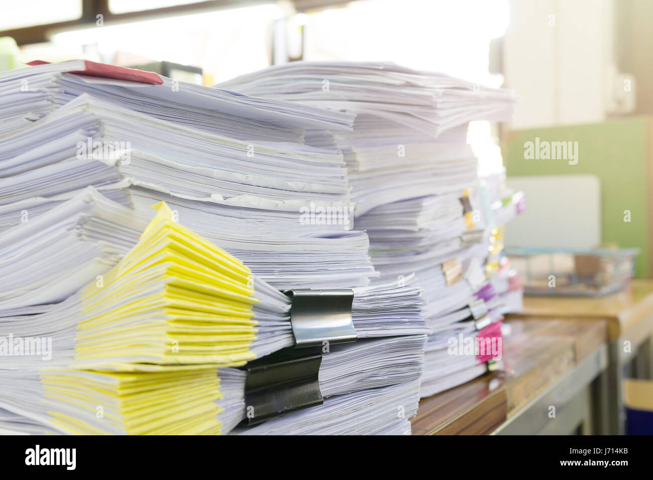 Pile of unfinished documents on office desk, Stack of business paper ...