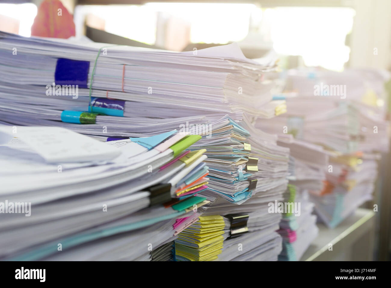 Pile of unfinished documents on office desk, Stack of business paper ...