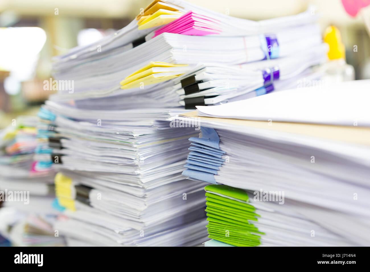 Pile of unfinished documents on office desk, Stack of business paper ...