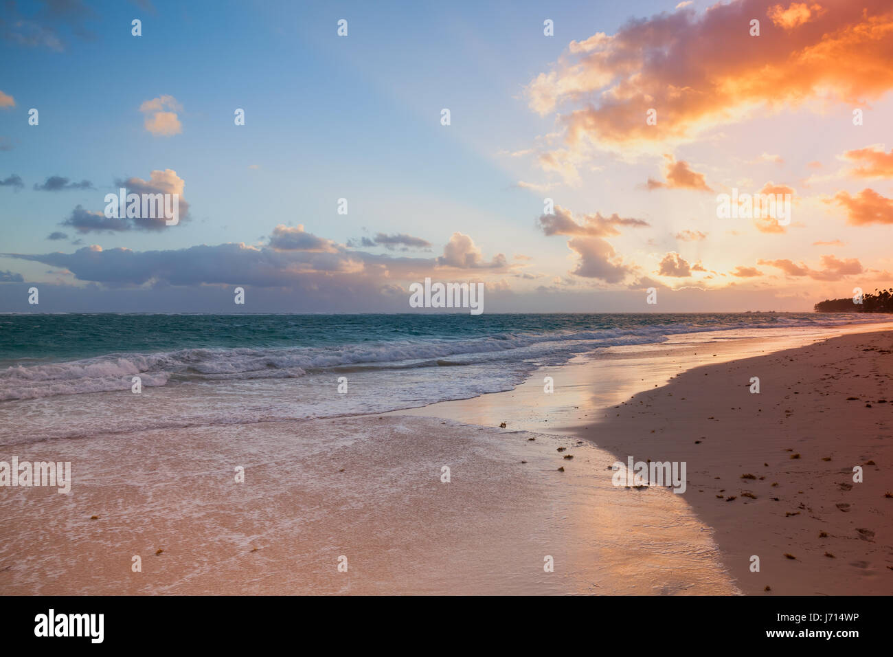 Orange sunrise over Atlantic Ocean coast, Bavaro beach, Hispaniola ...