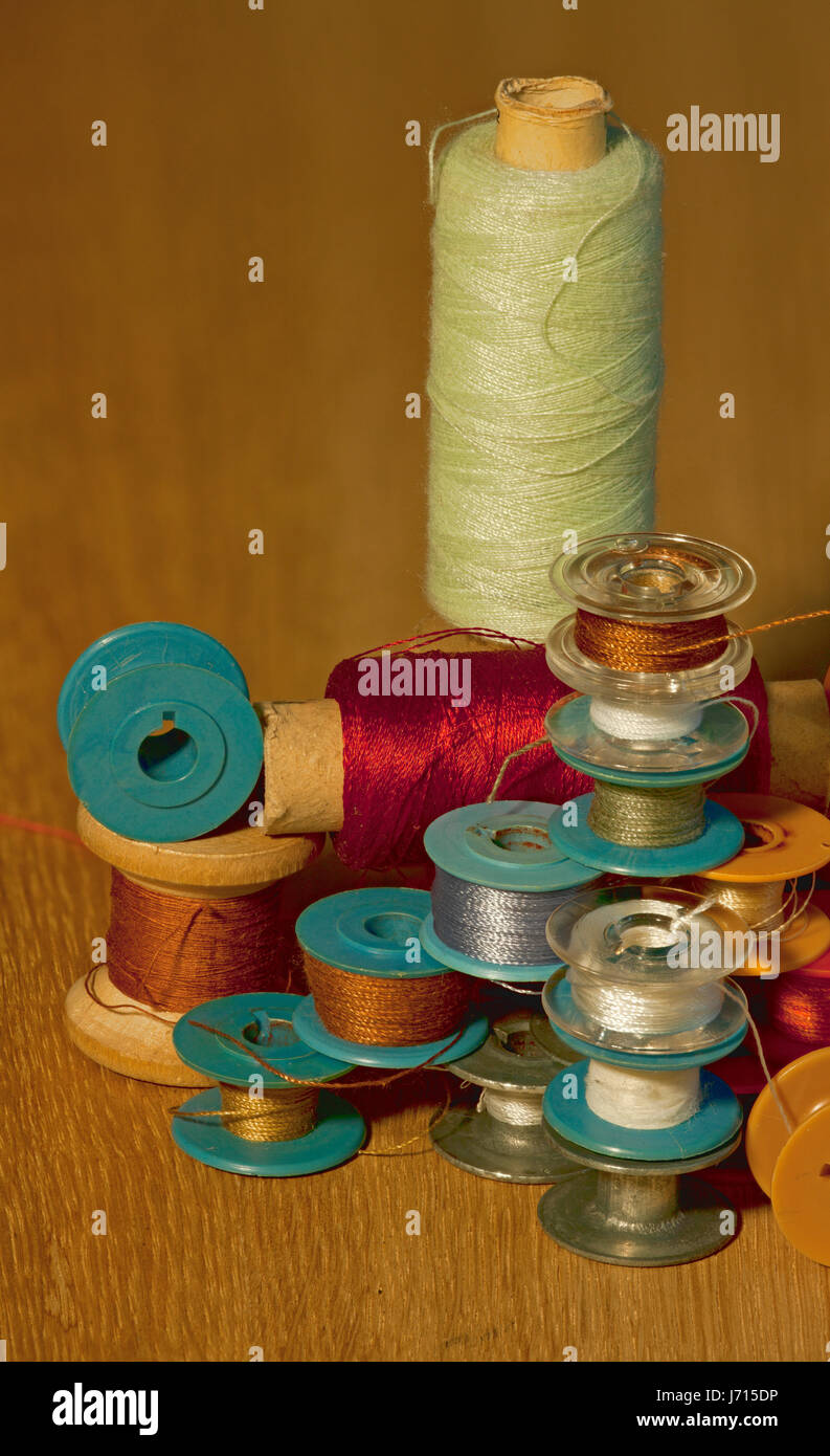 thread on different sizes coil, bobbin, reel and spool Stock Photo - Alamy
