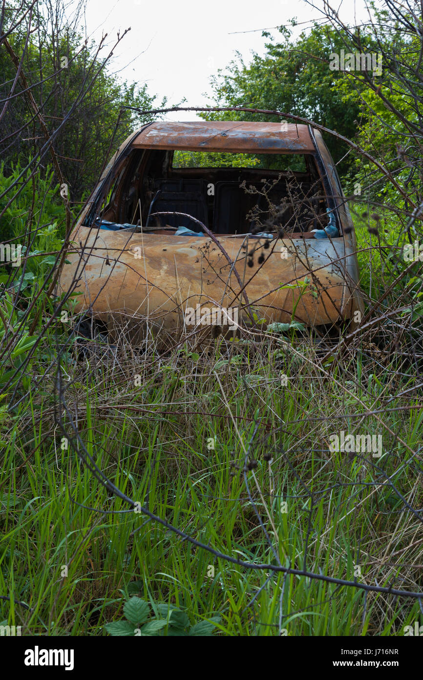 Burnt-out and Rusted Car Dumped near Country Park Stock Photo - Alamy