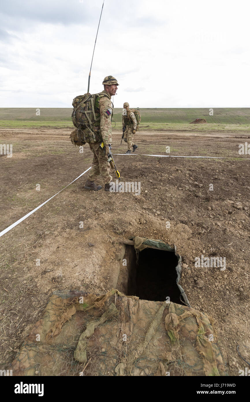 British soldiers run for a new position while being defended by a ...