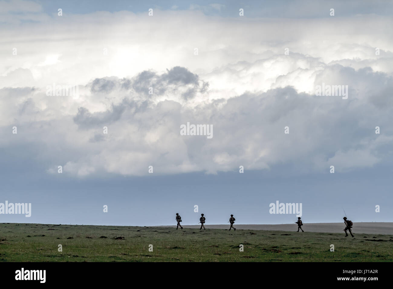 British soldiers run for a new position while being defended by a ...