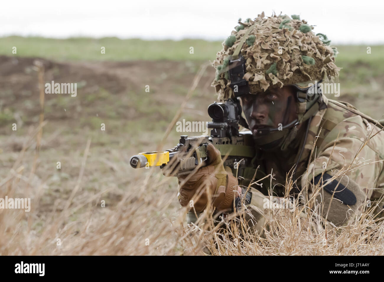 British soldiers run for a new position while being defended by a ...