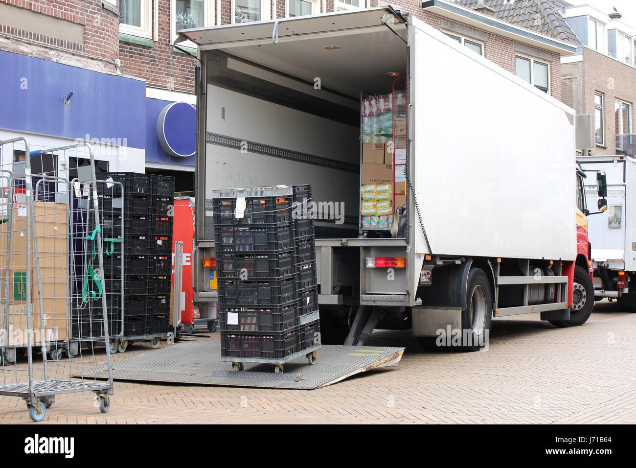 delivery truck being unloaded Stock Photo - Alamy
