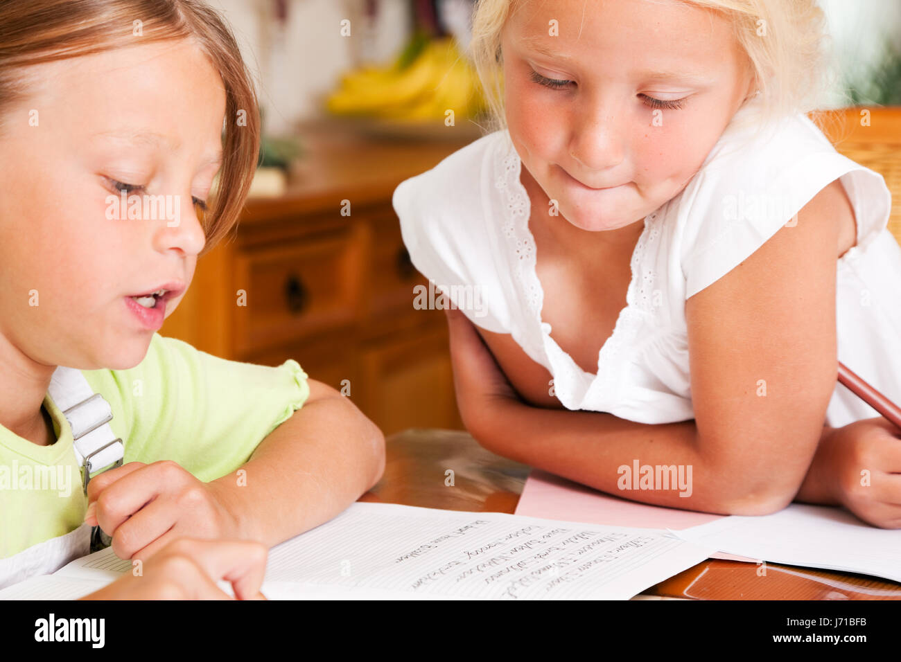 children doing homework in kitchen Stock Photo - Alamy