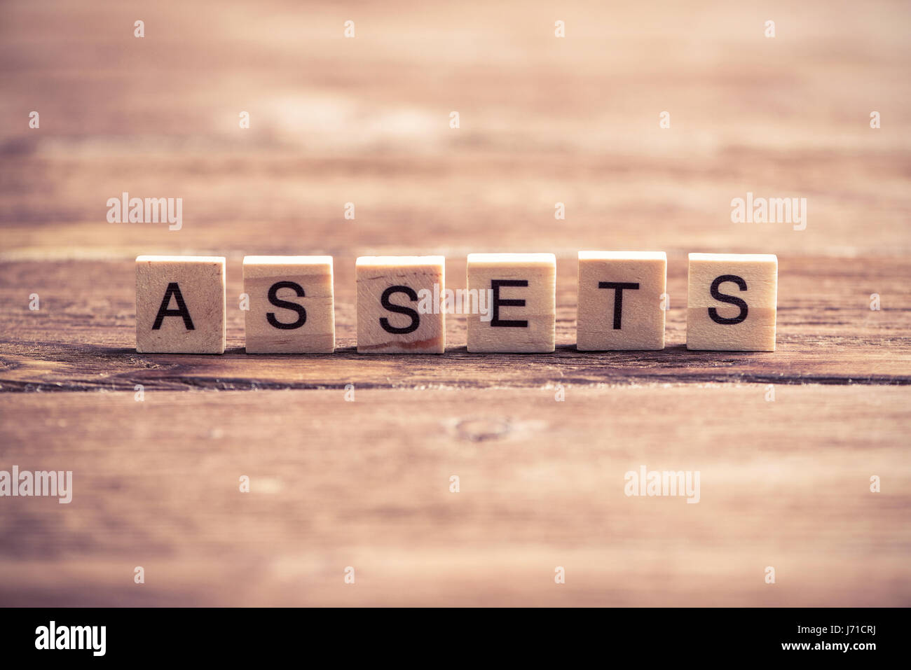 word assets of wooden elements with letters Stock Photo - Alamy