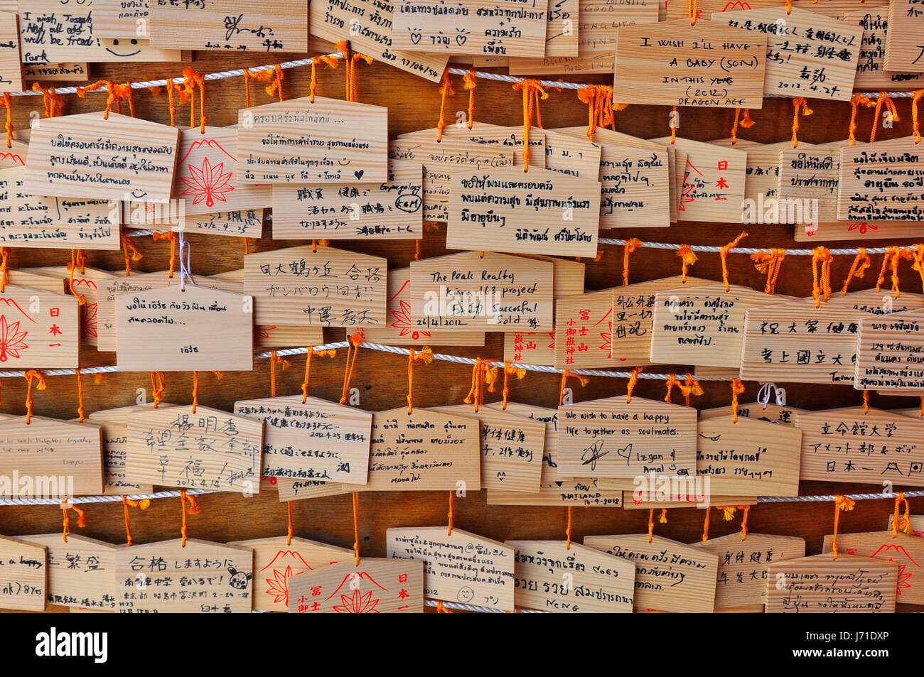Japanese ema or wishing plaques at a Shinto shrine with wishes from ...