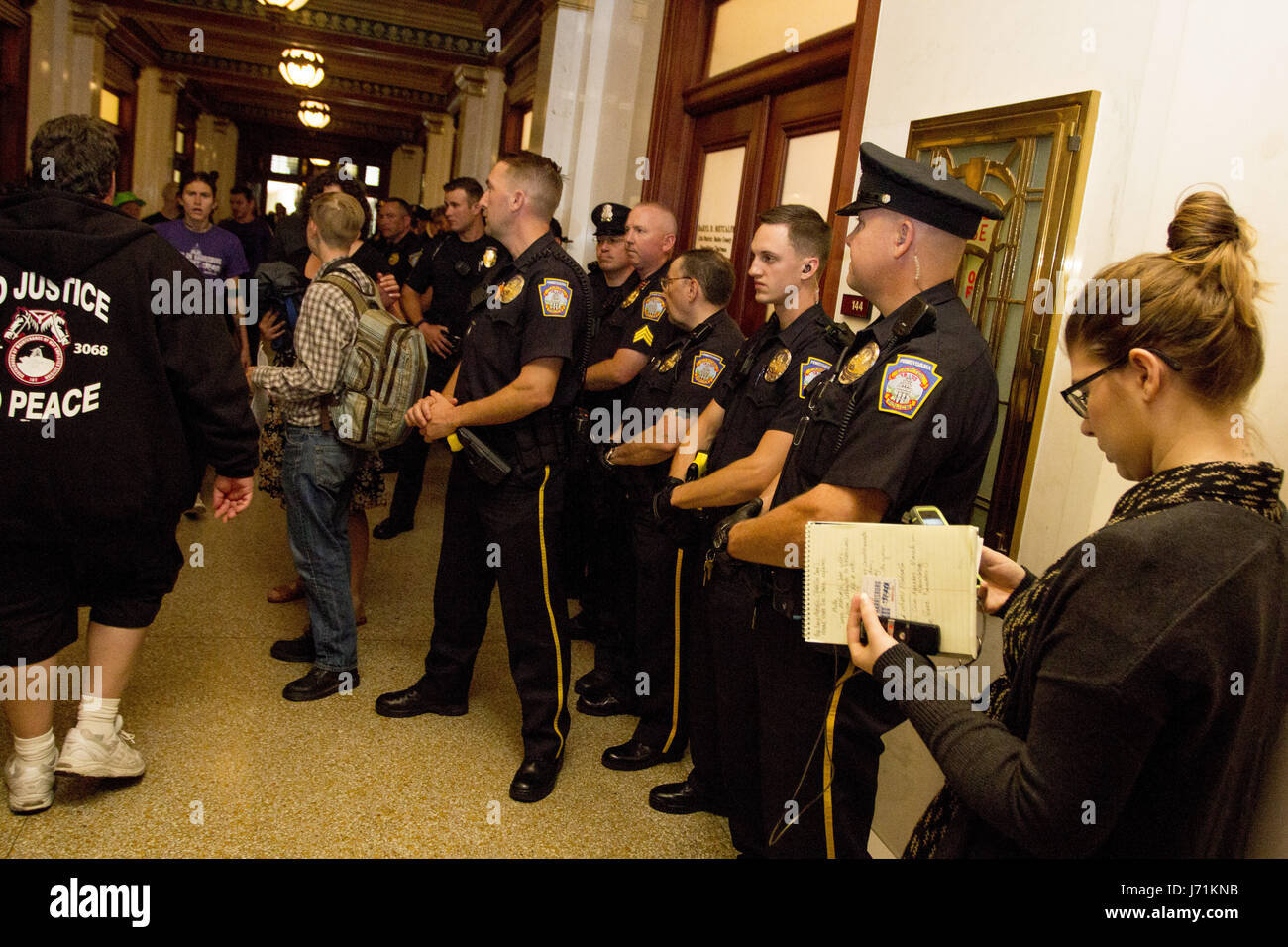 Harrisburg, USA. 22nd May, 2017. Police guard the office of PA State ...
