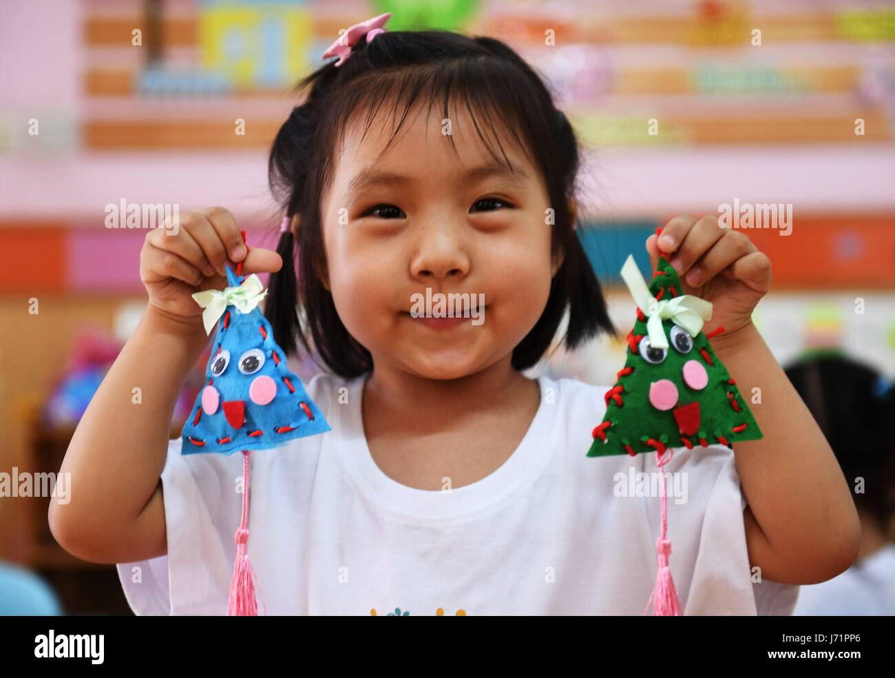 Shijiazhuang, China's Hebei Province. 23rd May, 2017. A girl displays ...