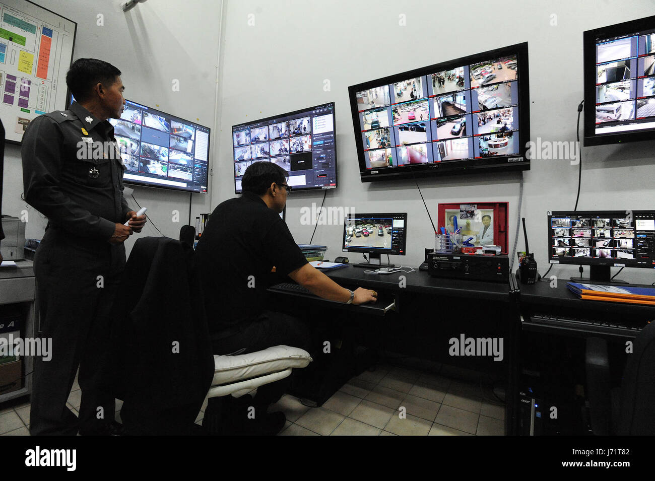 Bangkok, Thailand. 23rd May, 2017. Police officers check videos taken ...