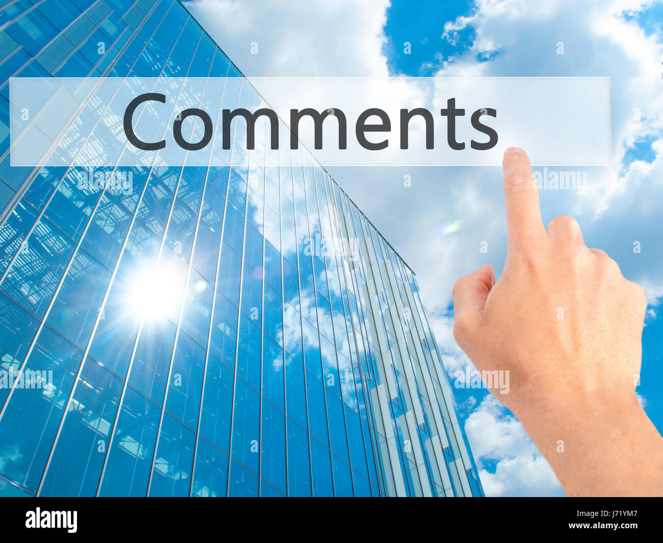 Comments - Hand pressing a button on blurred background concept ...