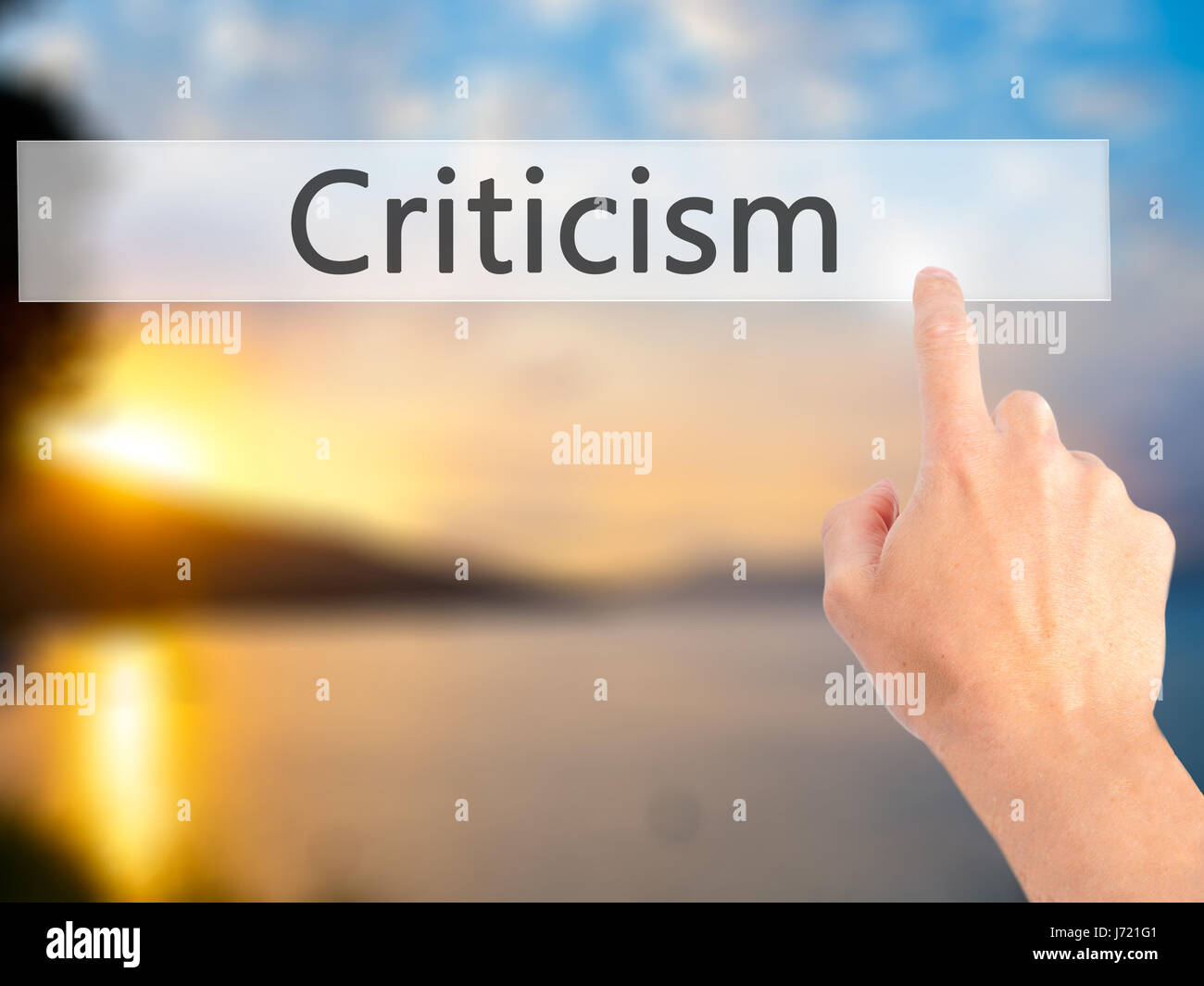Criticism - Hand pressing a button on blurred background concept ...