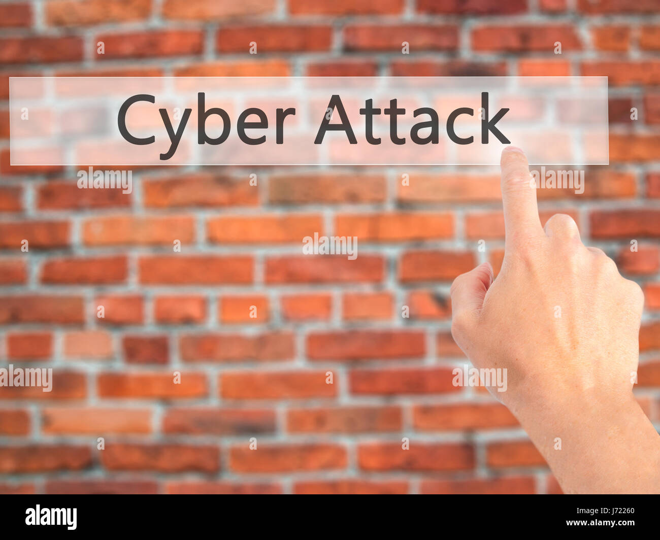 Cyber Attack - Hand pressing a button on blurred background concept ...