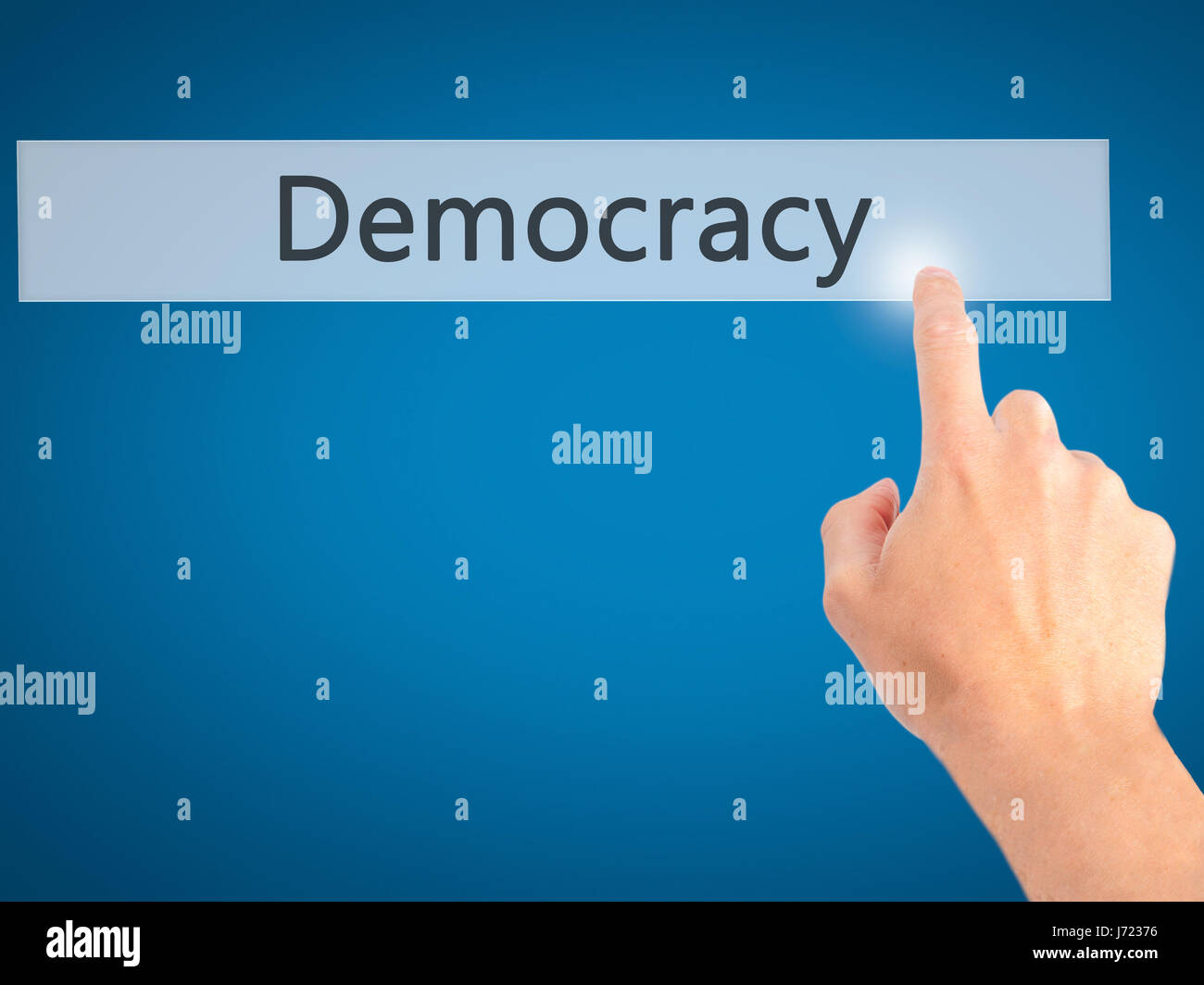 Democracy - Hand pressing a button on blurred background concept ...