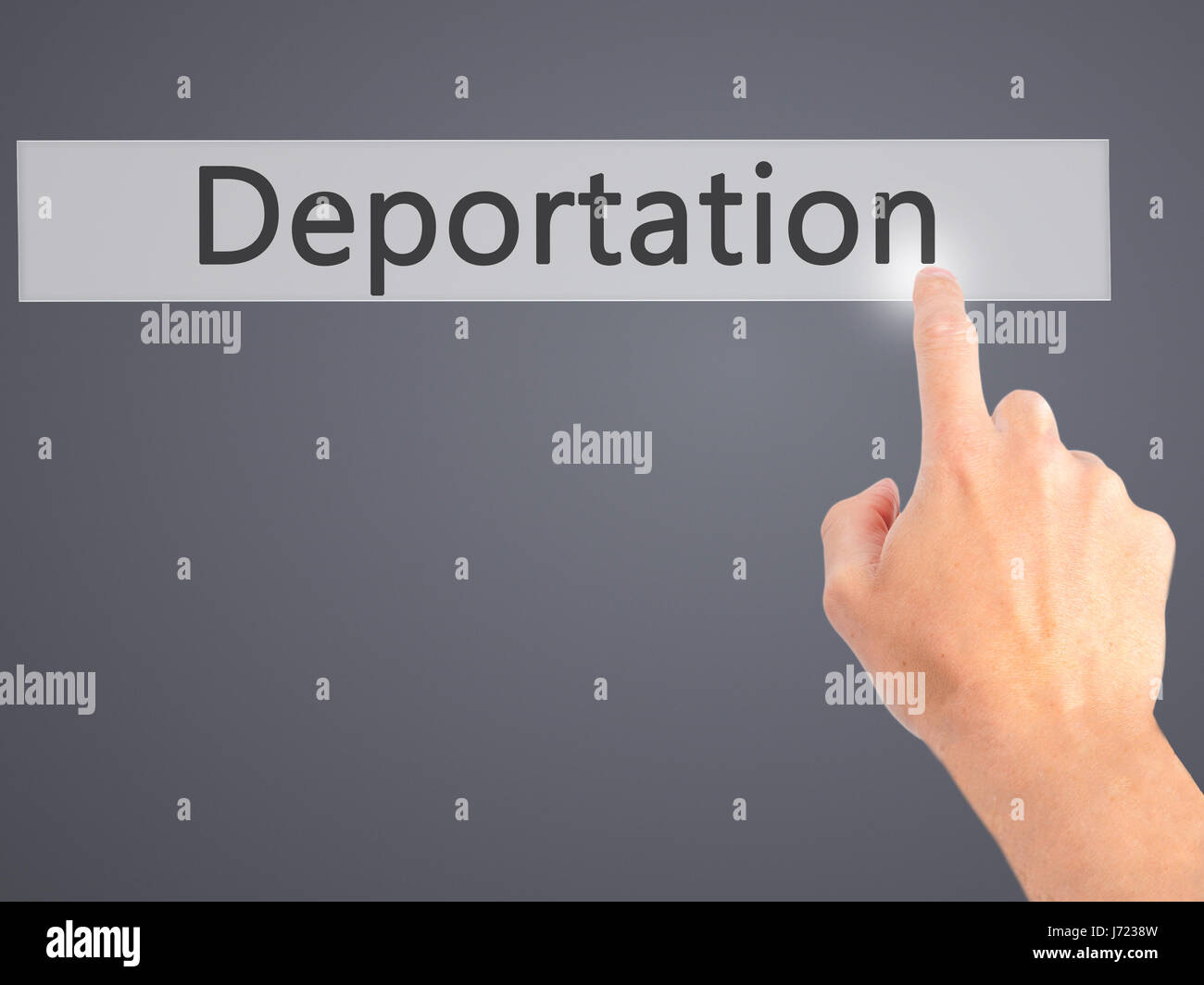 Deportation - Hand pressing a button on blurred background concept ...