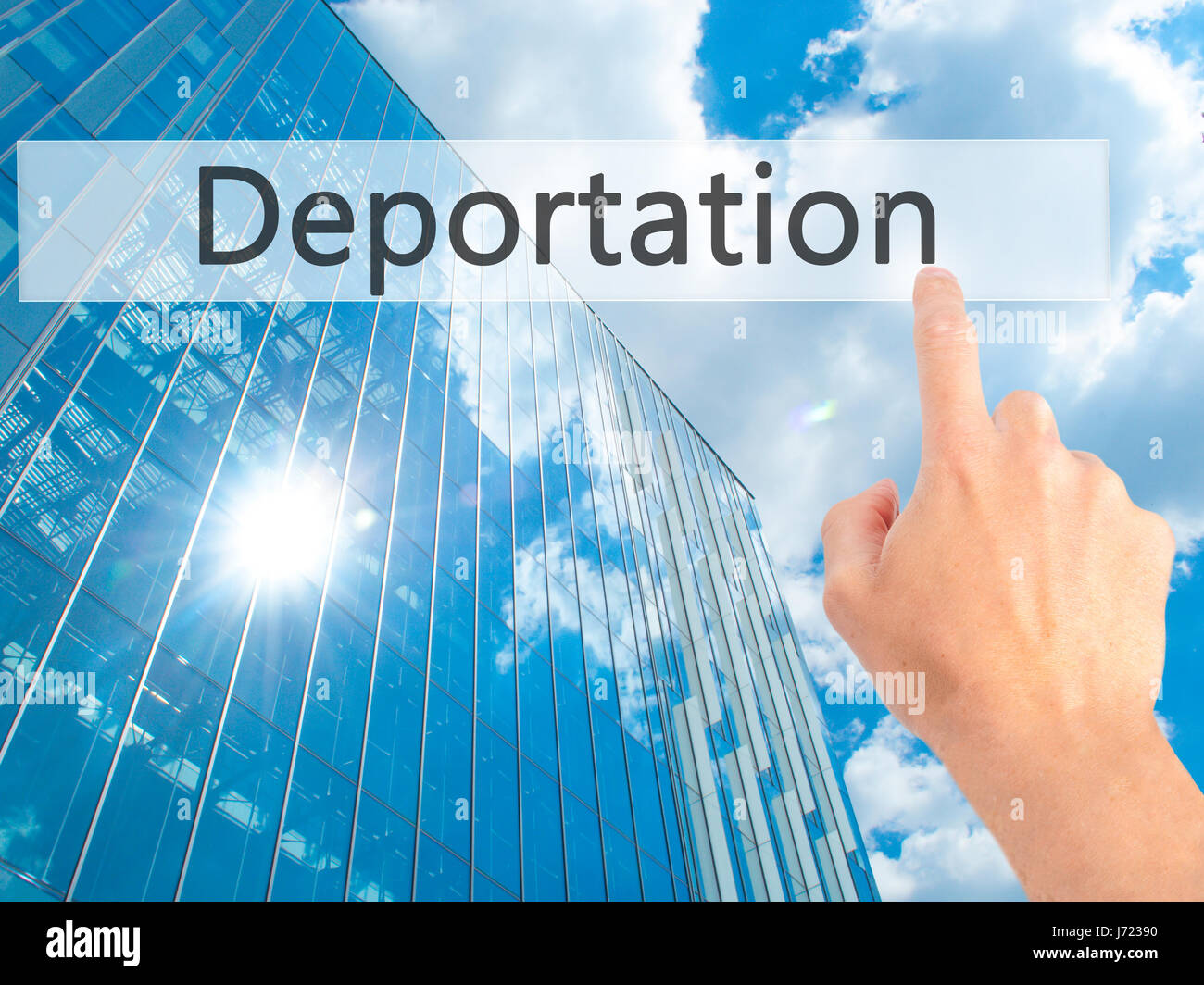 Deportation - Hand pressing a button on blurred background concept ...