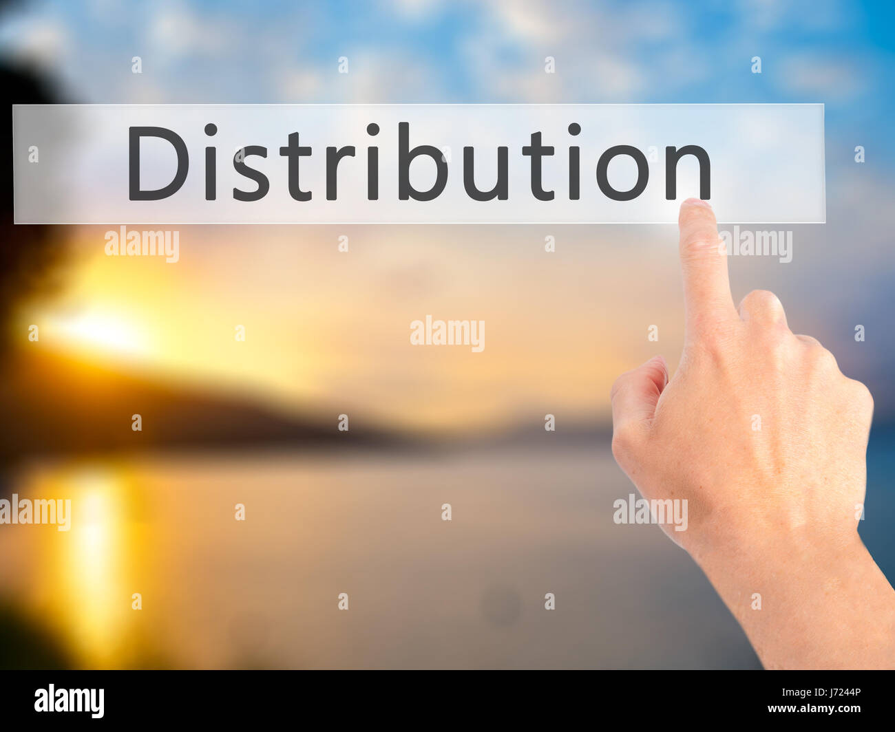 Distribution - Hand pressing a button on blurred background concept ...