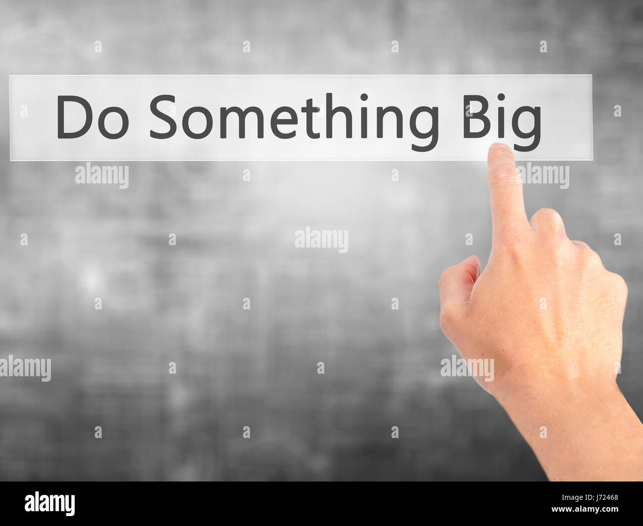 Do Something Big - Hand pressing a button on blurred background concept ...