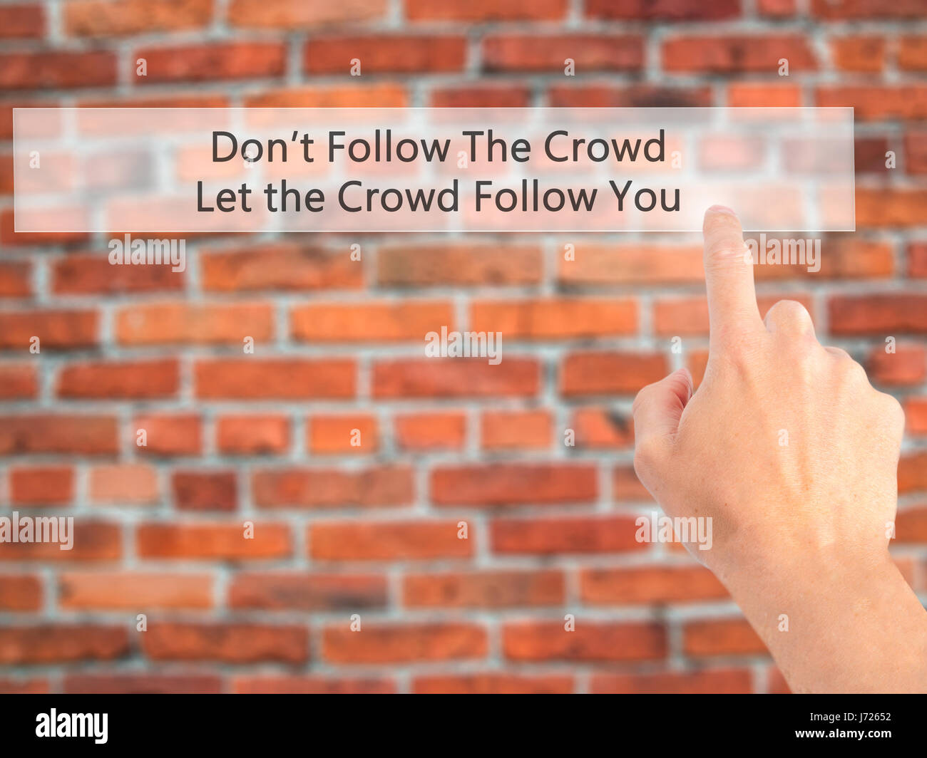 Don't Follow The Crowd Let the Crowd Follow You - Hand pressing a ...