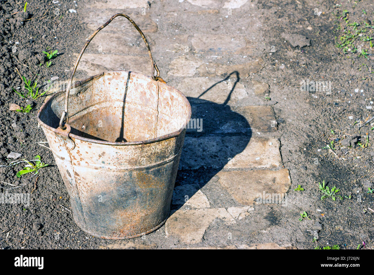 Old rusty bucket Stock Photo - Alamy