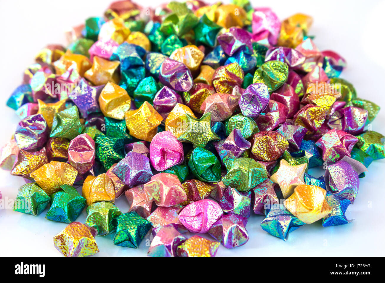 mass of colorful star paper on white background Stock Photo - Alamy