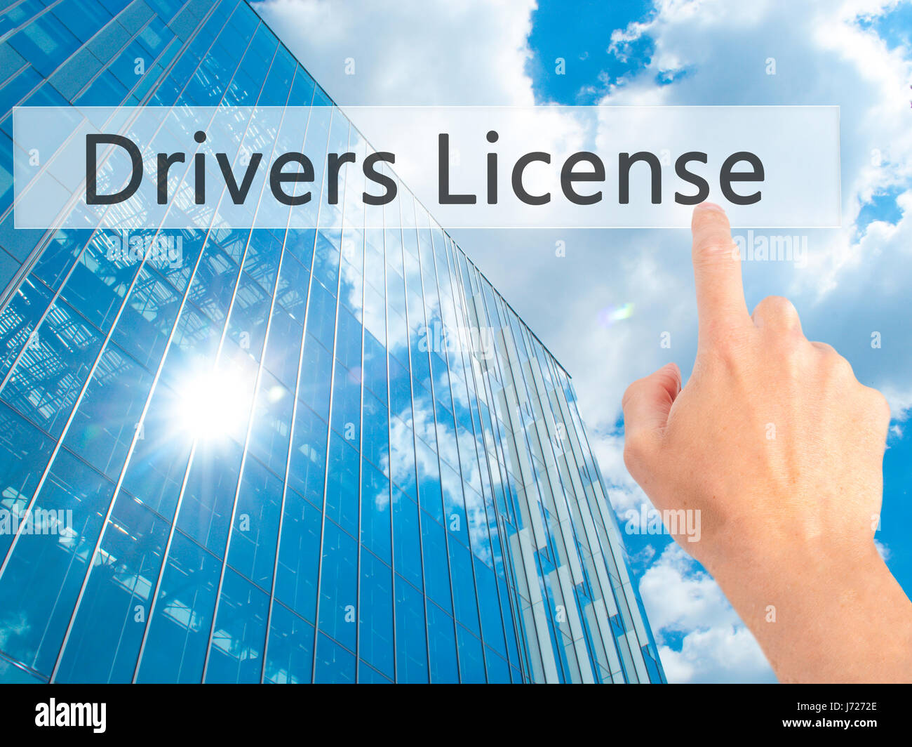 Drivers License - Hand pressing a button on blurred background concept ...