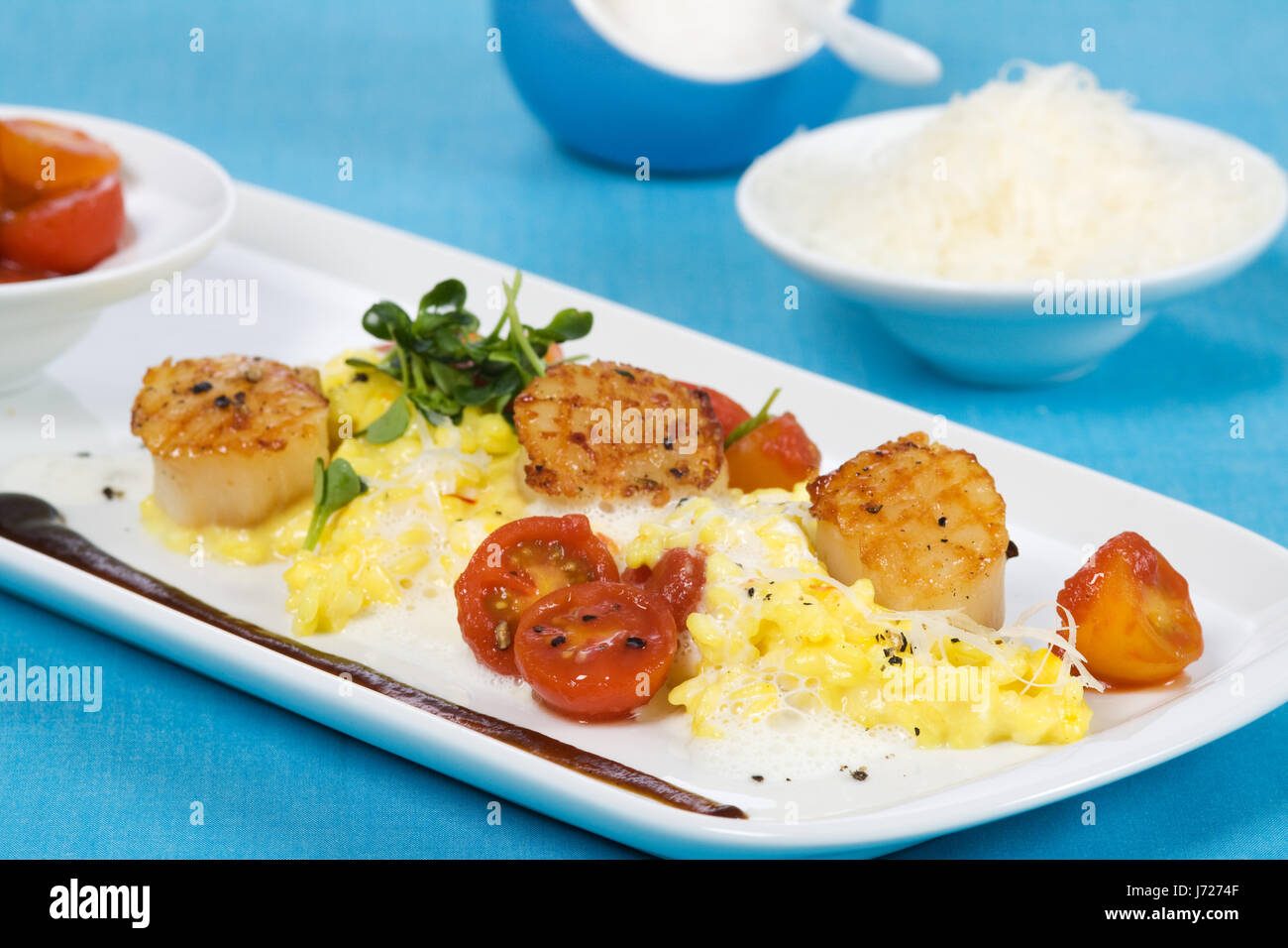 scallop risotto with tomatoes Stock Photo - Alamy