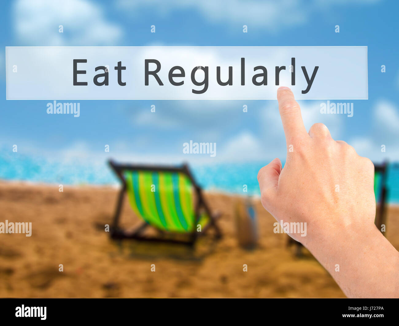 Eat Regularly - Hand pressing a button on blurred background concept ...