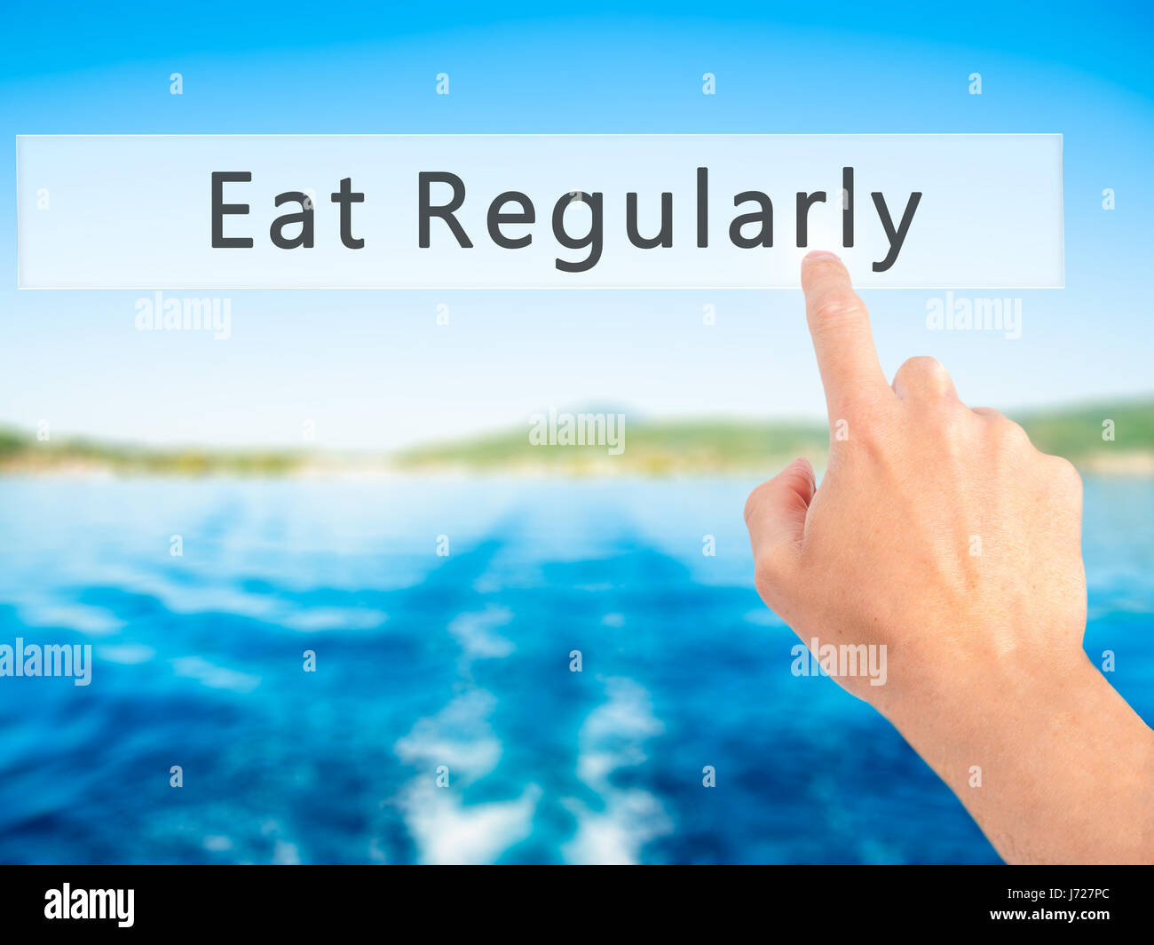 Eat Regularly - Hand pressing a button on blurred background concept ...