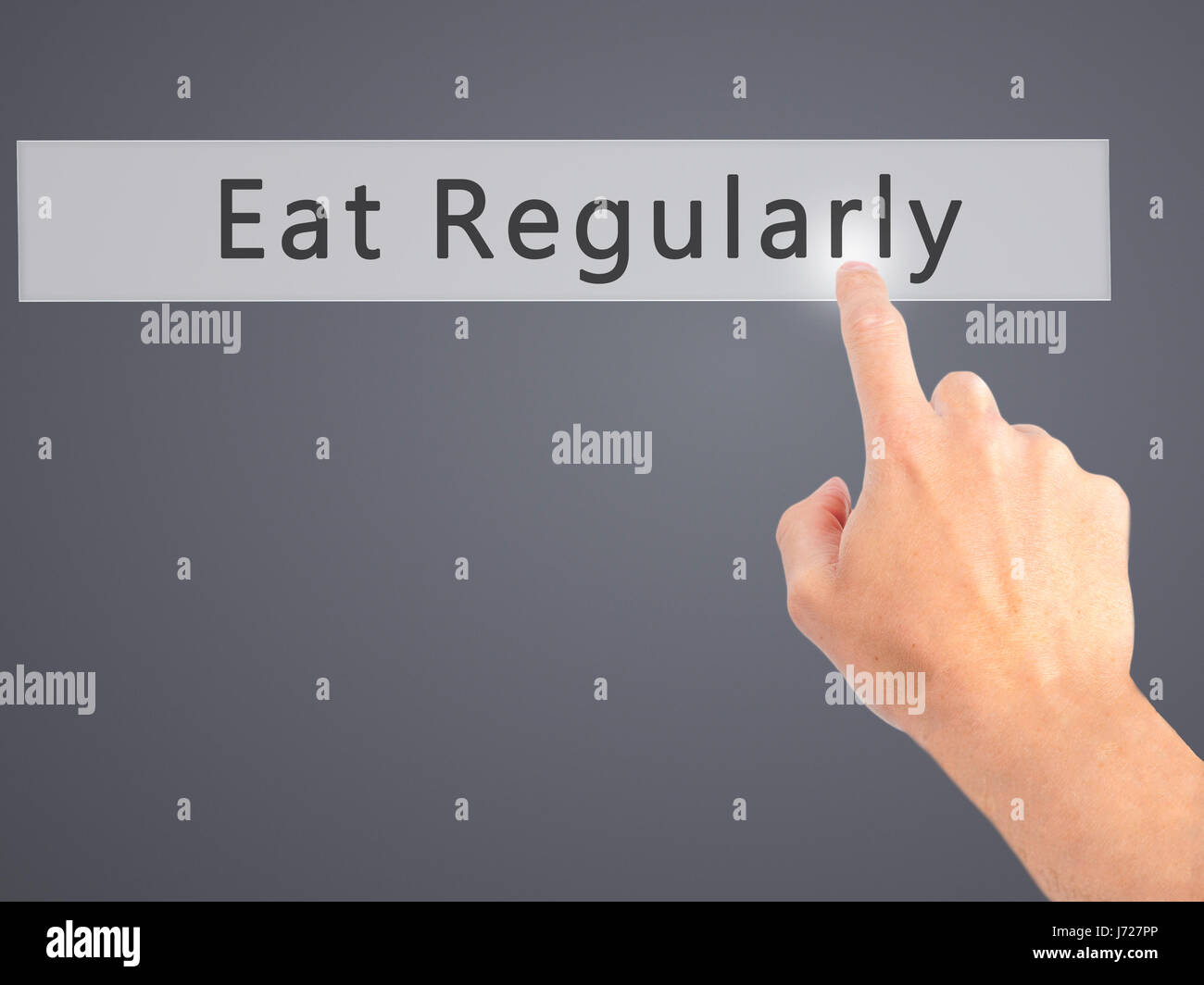 Eat Regularly - Hand pressing a button on blurred background concept ...